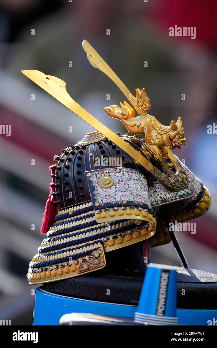 A samuria warriors helmet is shown in the Los Angeles Angels dugout ...