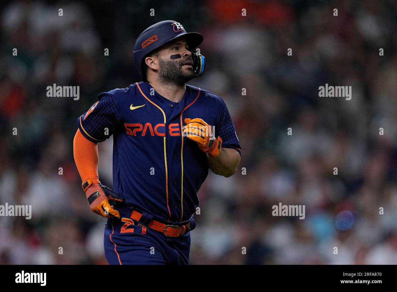 Houston Astros' Jose Altuve jogs to first base after drawing a walk ...