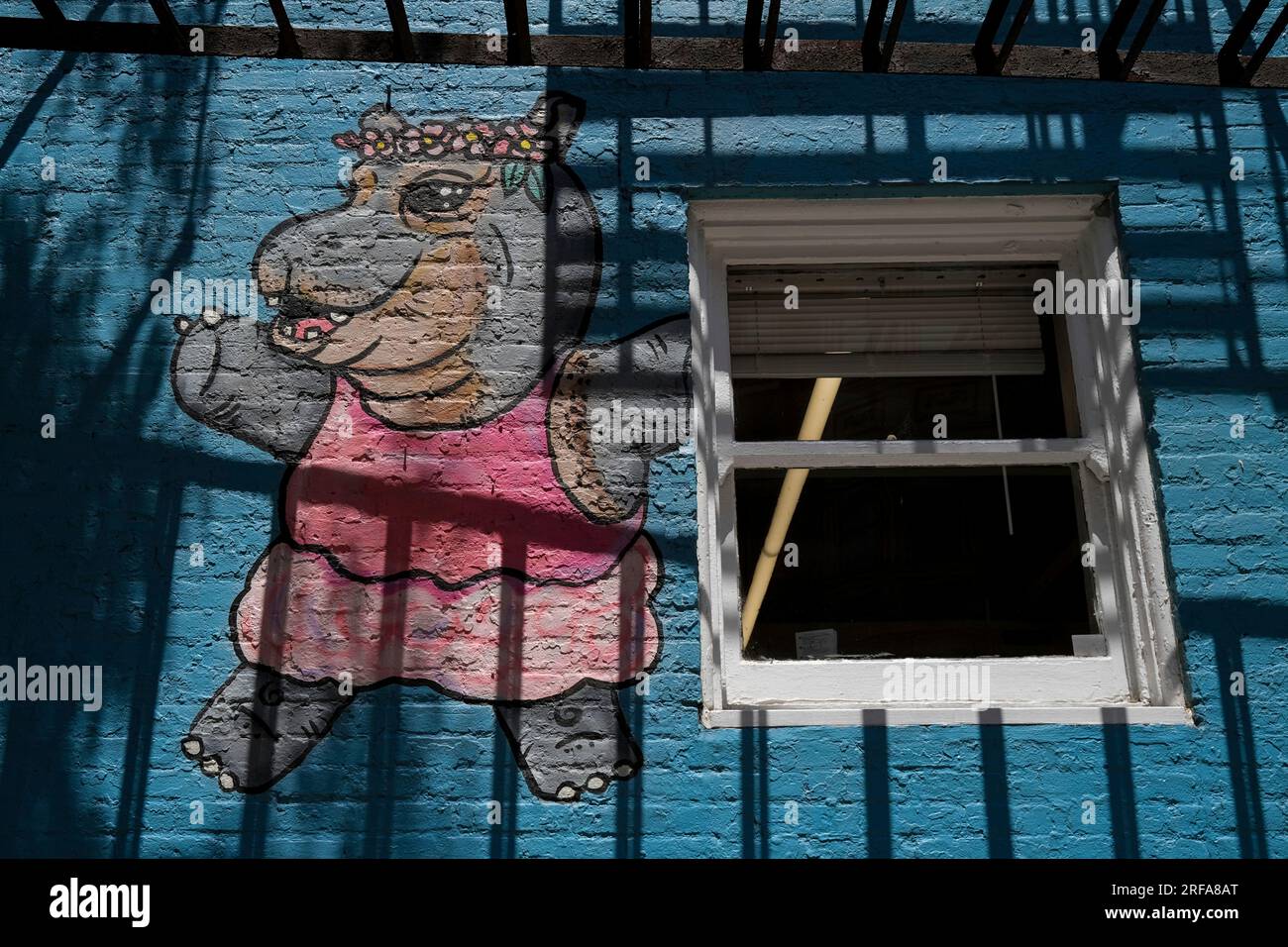 The mural of ballerina hippos done by Joshua Stout is seen on Eighth ...