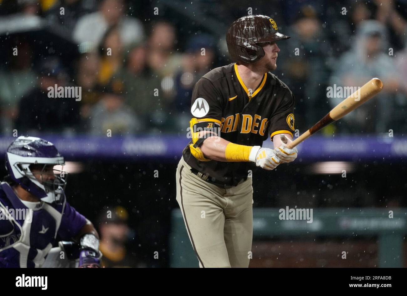 San Diego Padres' Jake Cronenworth follows the flight of his RBI single ...