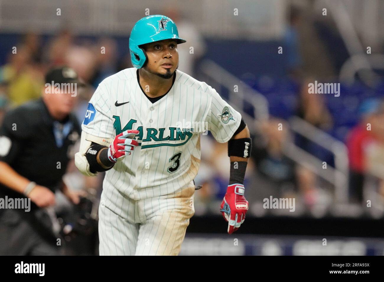 Miami Marlins' Luis Arraez (3) runs to first base during a baseball ...