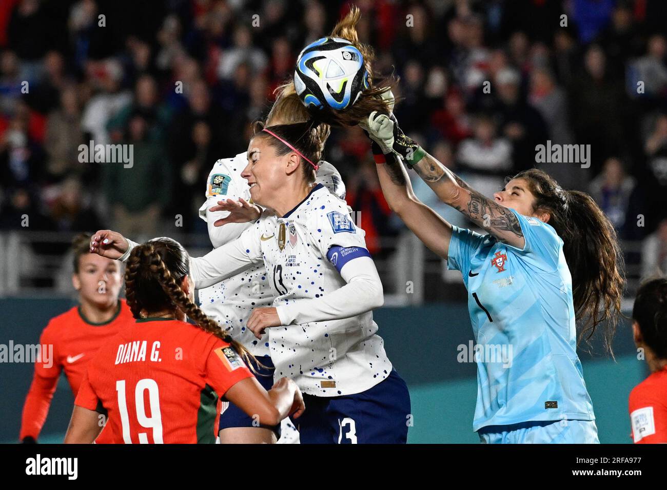 Portugal's goalkeeper Ines Pereira, right, punches the ball clear of ...