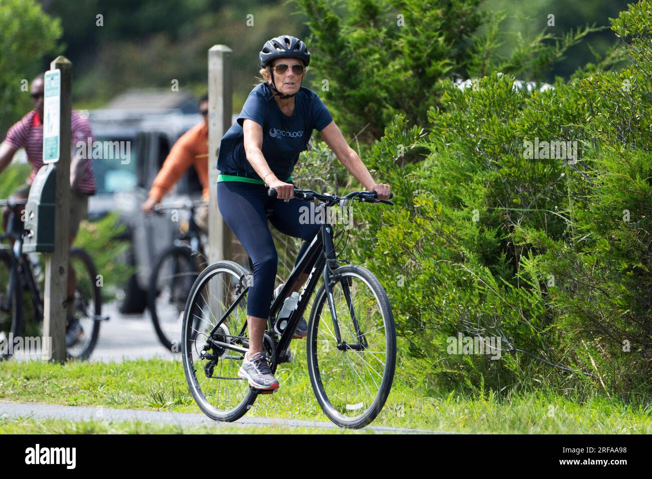 First lady Jill Biden rides her bike on a bike path with President Joe ...
