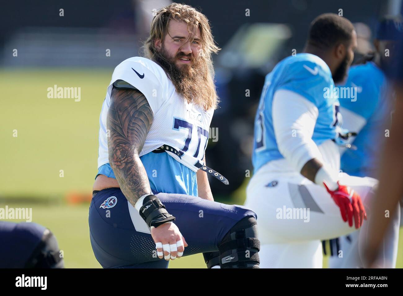 Tennessee Titans guard Jordan Roos stretches during an NFL football ...