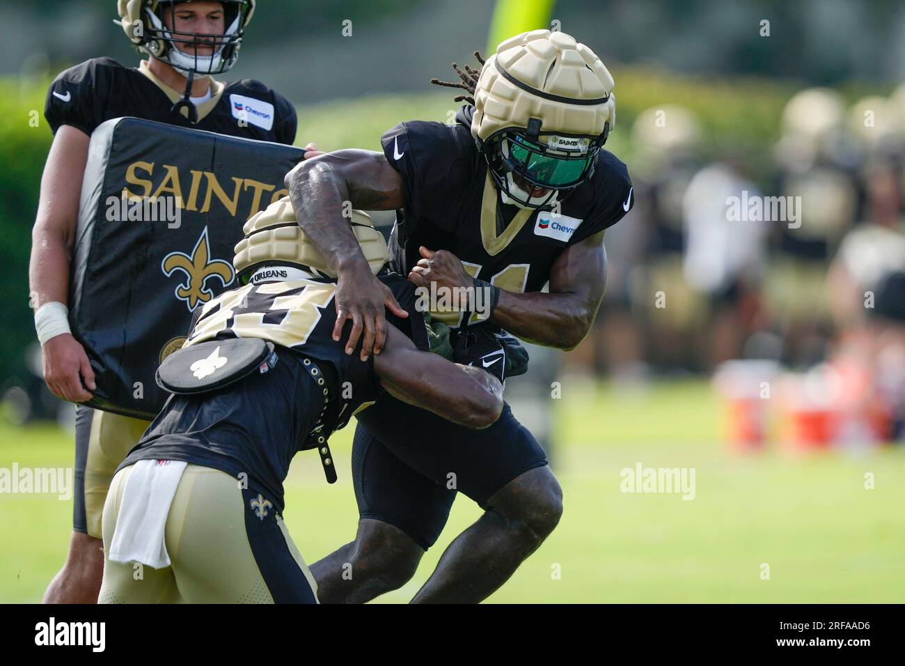 New Orleans Saints running back Alvin Kamara, facing, runs through ...