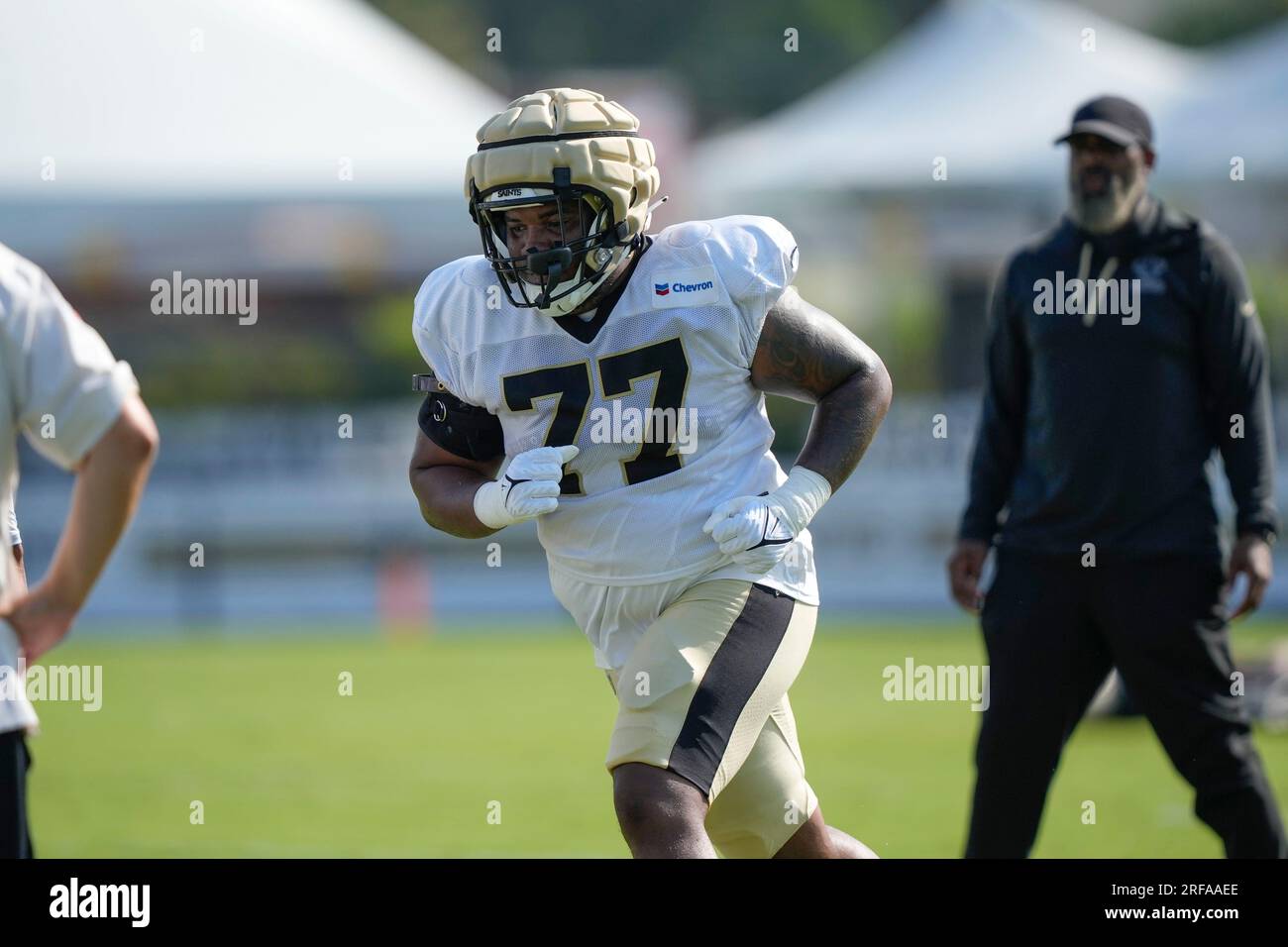 New Orleans Saints defensive tackle Jerron Cage (77) runs through ...