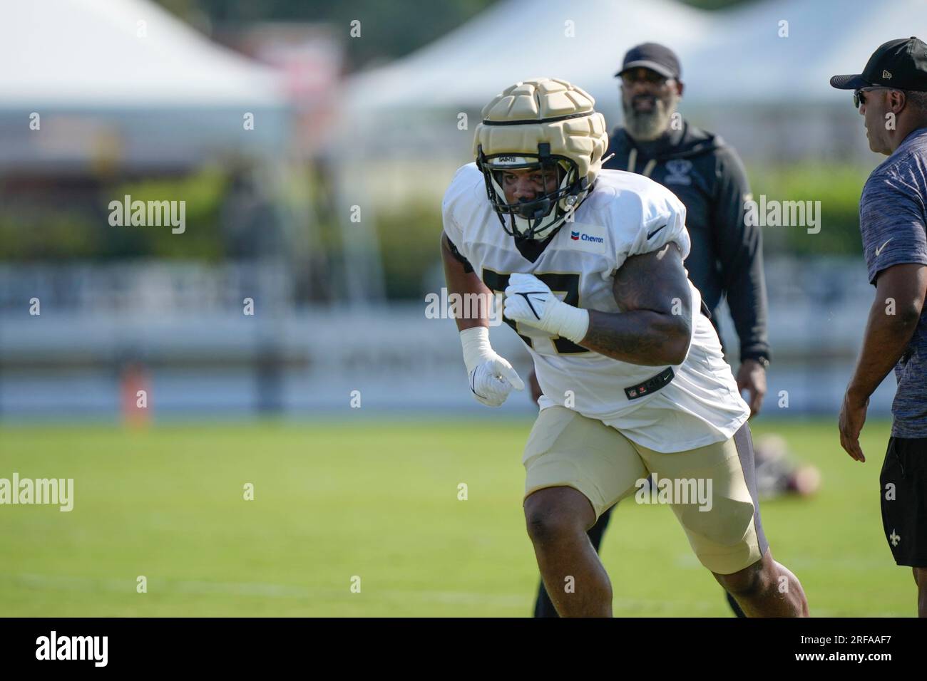 New Orleans Saints defensive tackle Jerron Cage (77) runs through ...