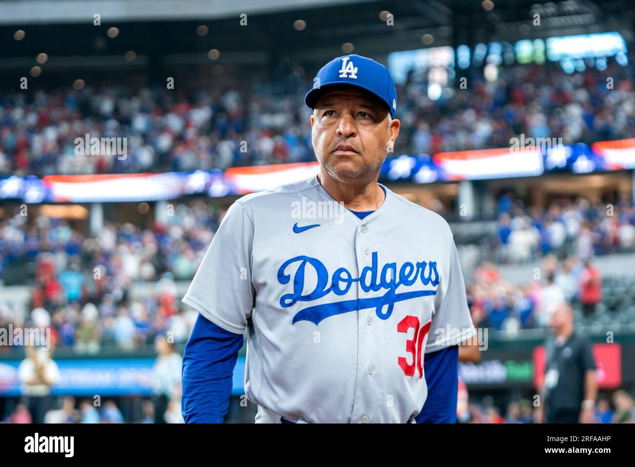 Los Angeles Dodgers manager Dave Roberts walks off the field before a ...