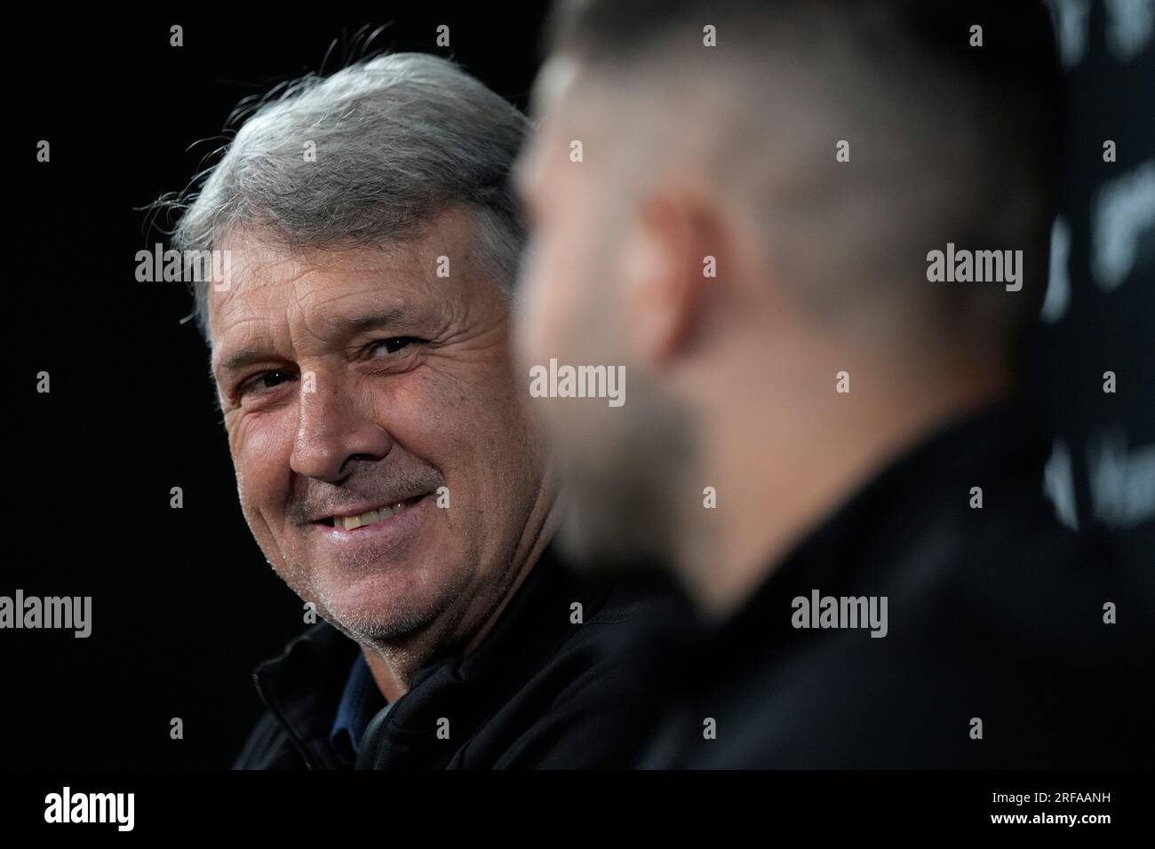 Inter Miami head coach Gerardo "Tata" Martino smiles toward defender ...