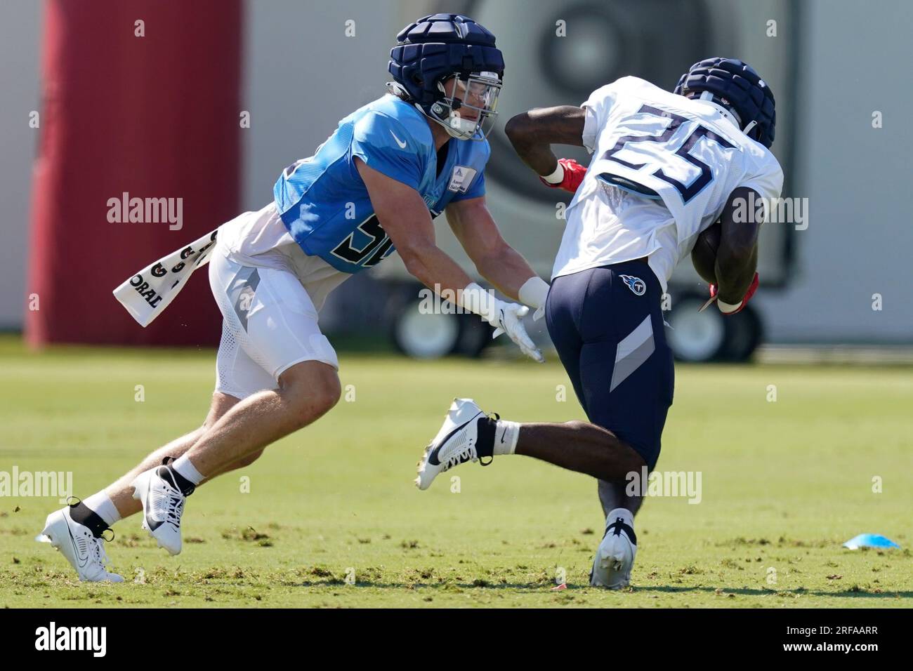 Tennessee Titans linebacker Jack Gibbens, left, chases down running ...
