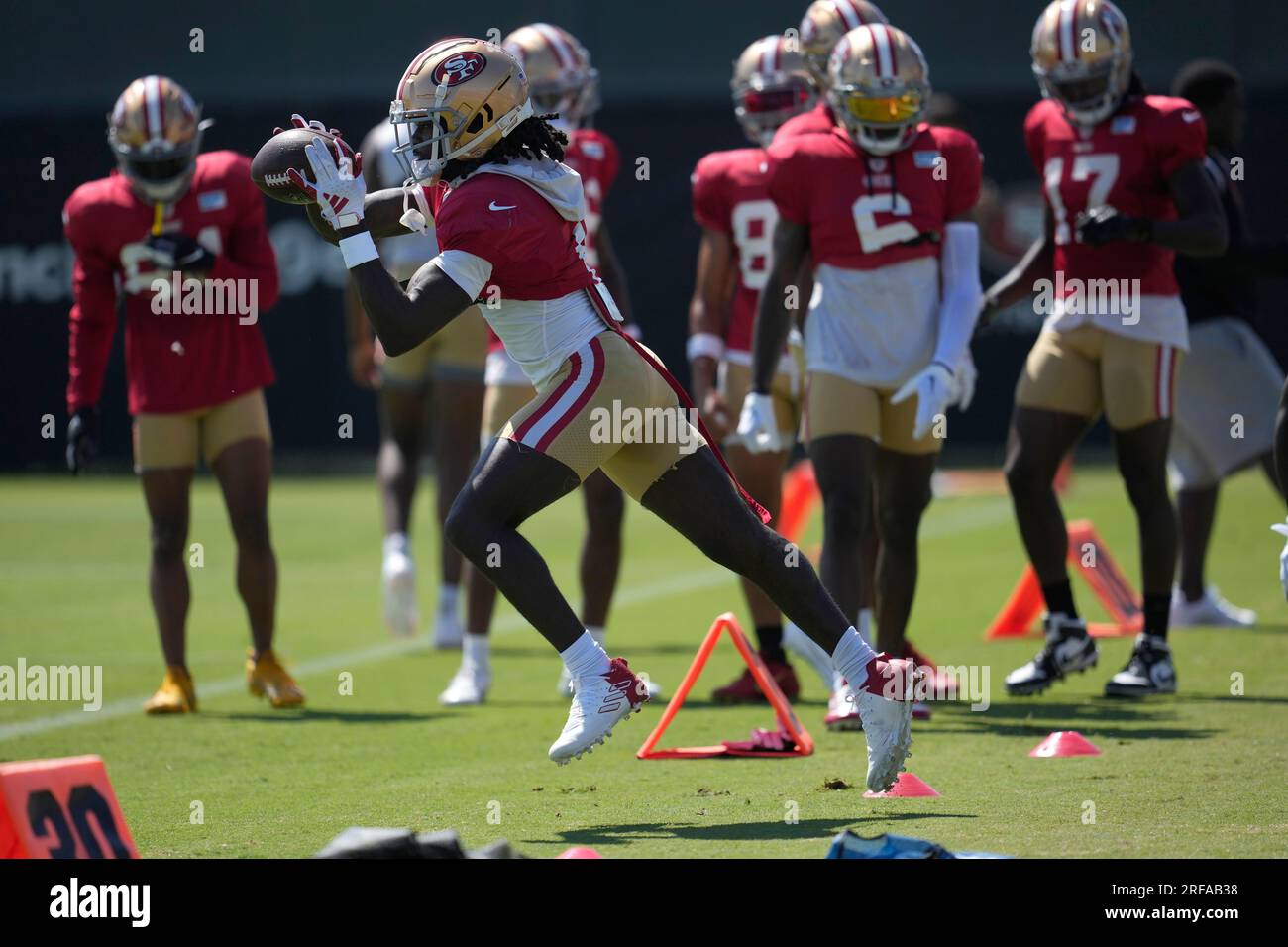 San Francisco 49ers wide receiver Brandon Aiyuk, foreground, takes part ...