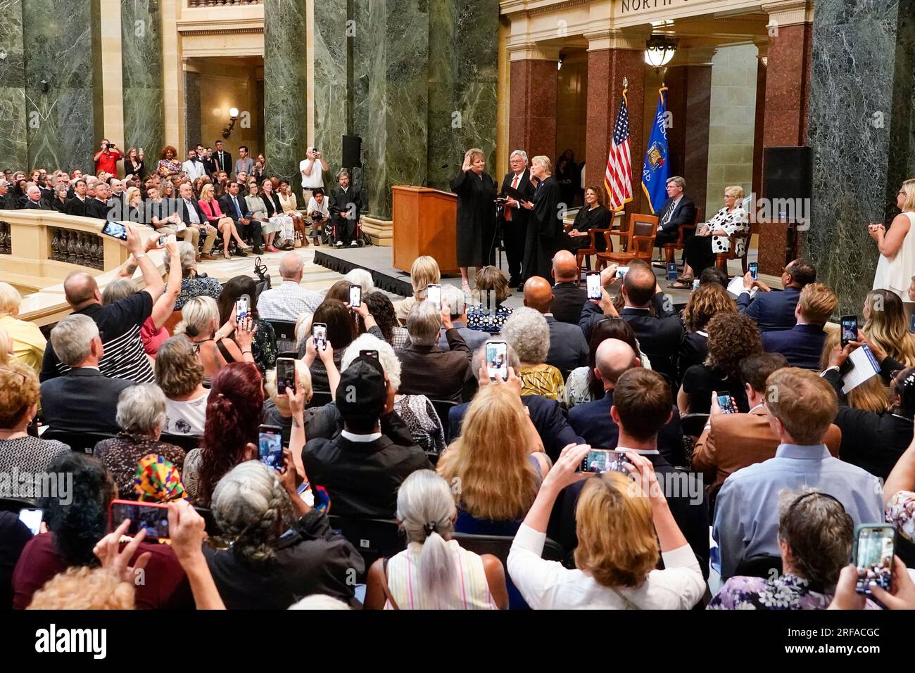 Janet Protasiewicz, center, is sworn by Supreme Court Justice Ann Walsh ...