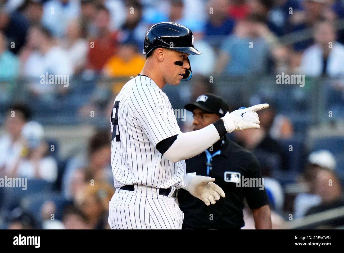 New York Yankees' Aaron Judge gestures to teammates after hitting a ...