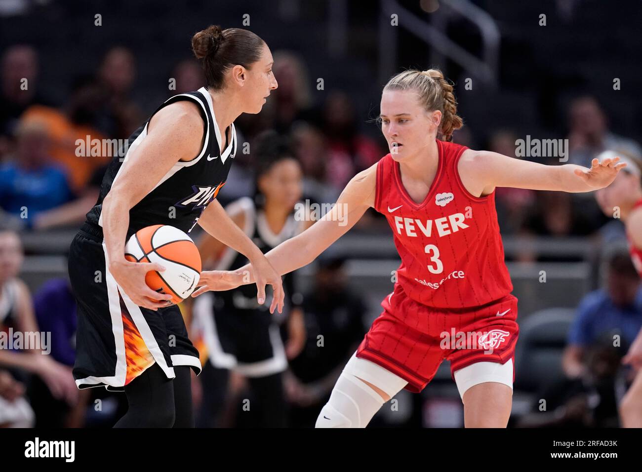 Phoenix Mercury's Diana Taurasi is defended by Indiana Fever's Kristy ...
