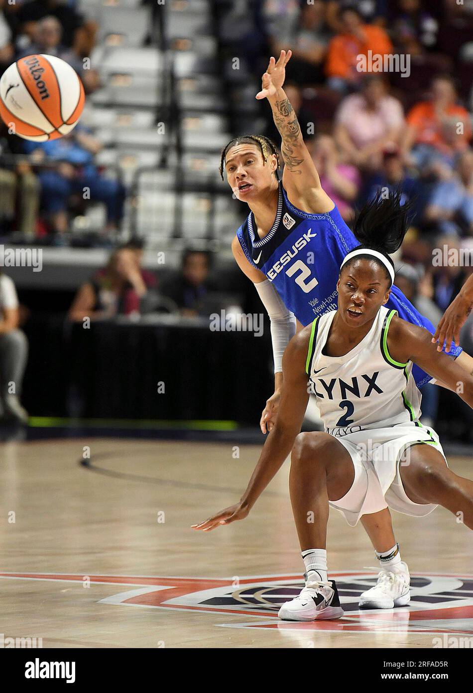 Connecticut Sun's Natisha Hiedeman (2) tangles with Minnesota Lynx's ...