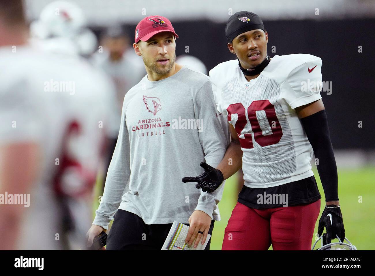 Arizona Cardinals defensive coordinator Nick Rallis, left, walks with ...