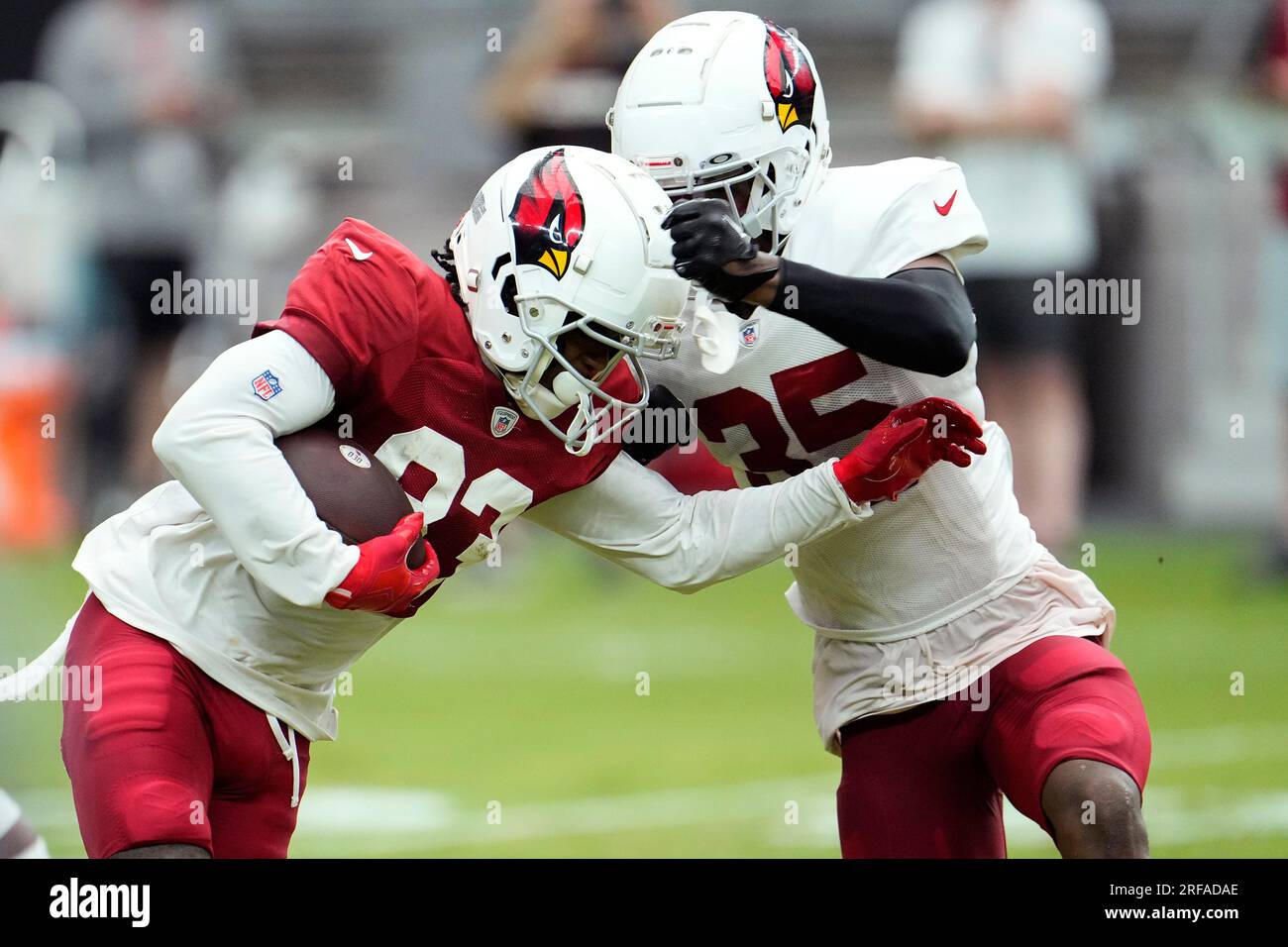 Arizona Cardinals wide receiver Greg Dortch, left, runs with the ball ...