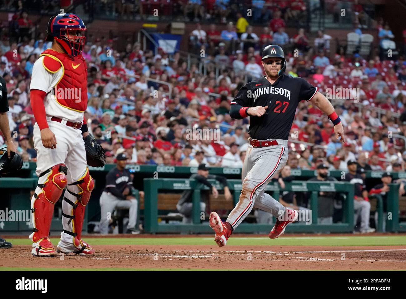 Minnesota Twins' Ryan Jeffers (27) scores past St. Louis Cardinals ...