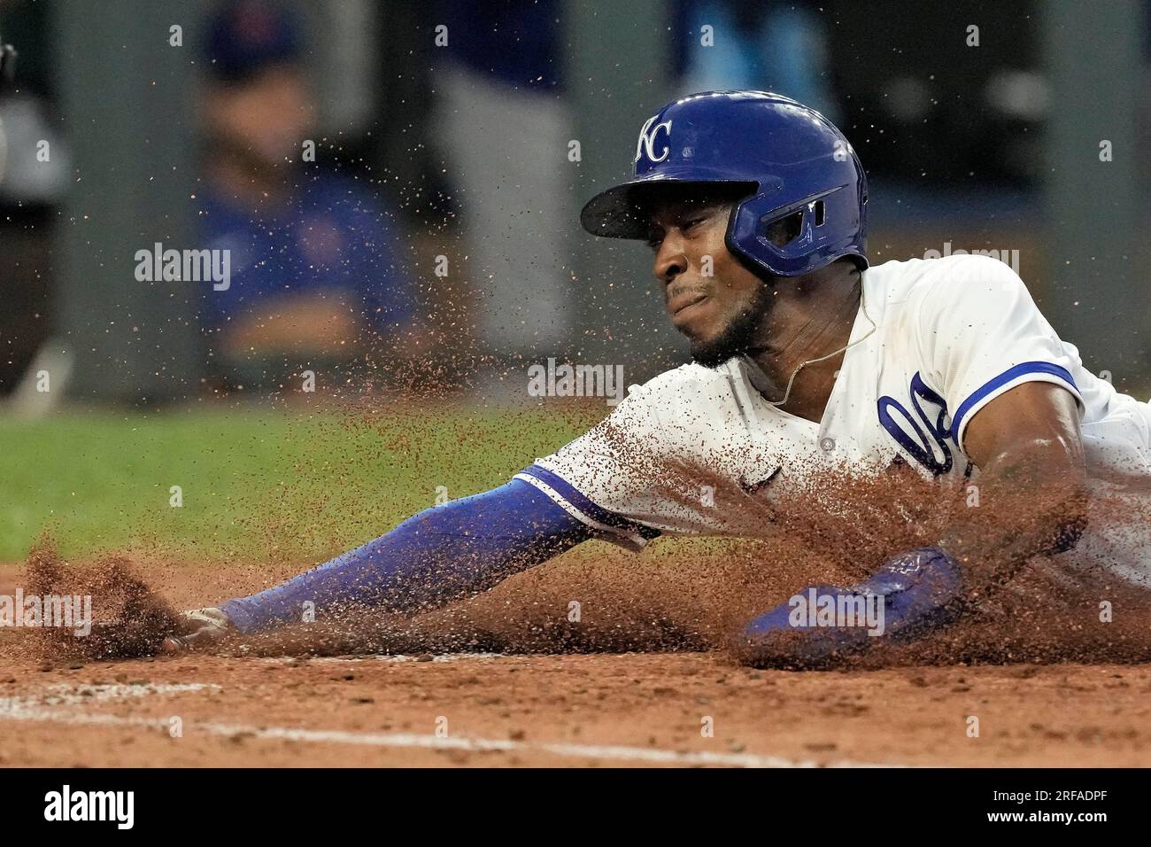 Kansas City Royals' Samad Taylor slides home to score on a sacrifice ...