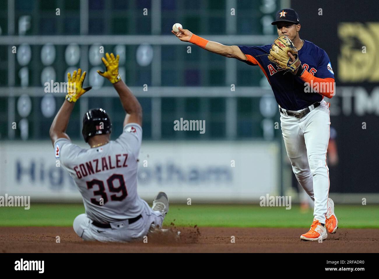 Houston Astros shortstop Jeremy Pena turns a double play on Cleveland ...