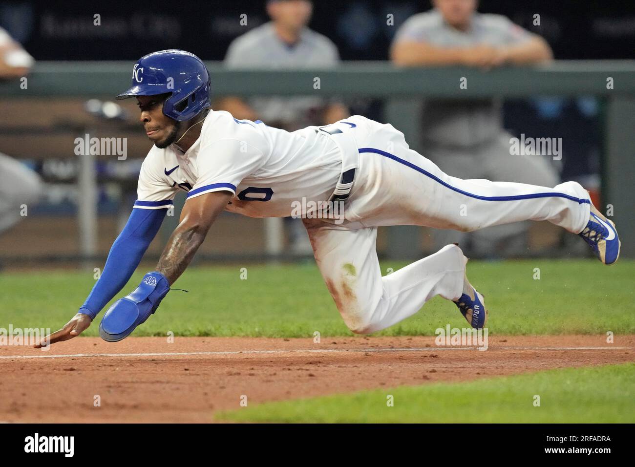 Kansas City Royals' Samad Taylor slides home to score on a sacrifice ...