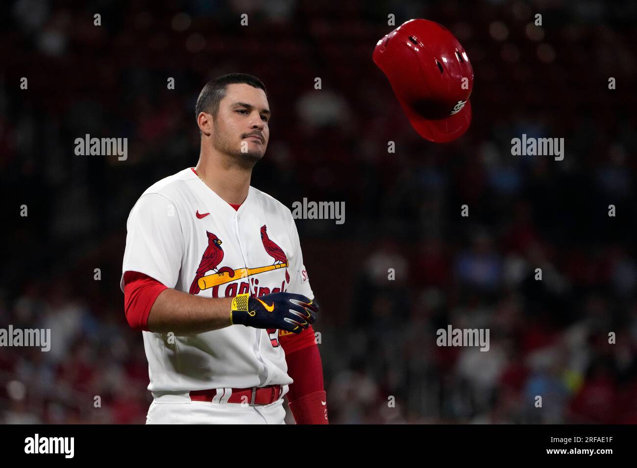 St. Louis Cardinals' Nolan Arenado tosses his helmet after flying out ...
