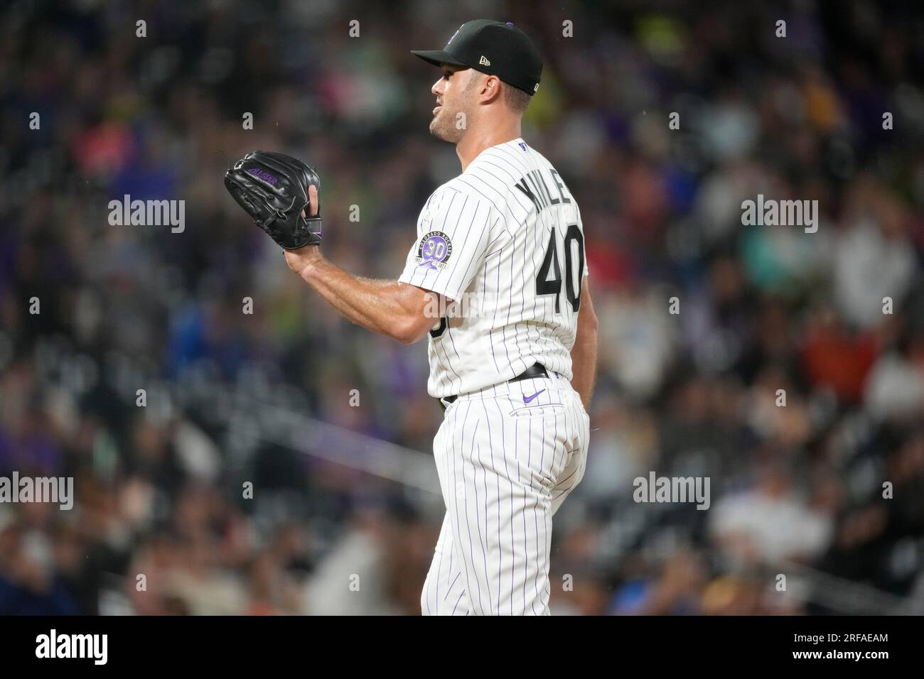 Colorado Rockies relief pitcher Tyler Kinley calls for a new ball after ...