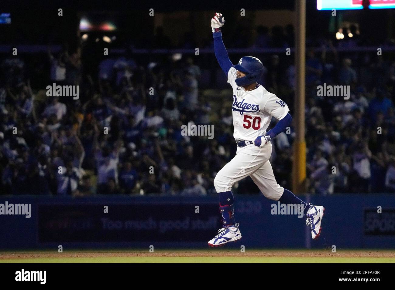 Los Angeles Dodgers' Mookie Betts rounds second after hitting a solo ...