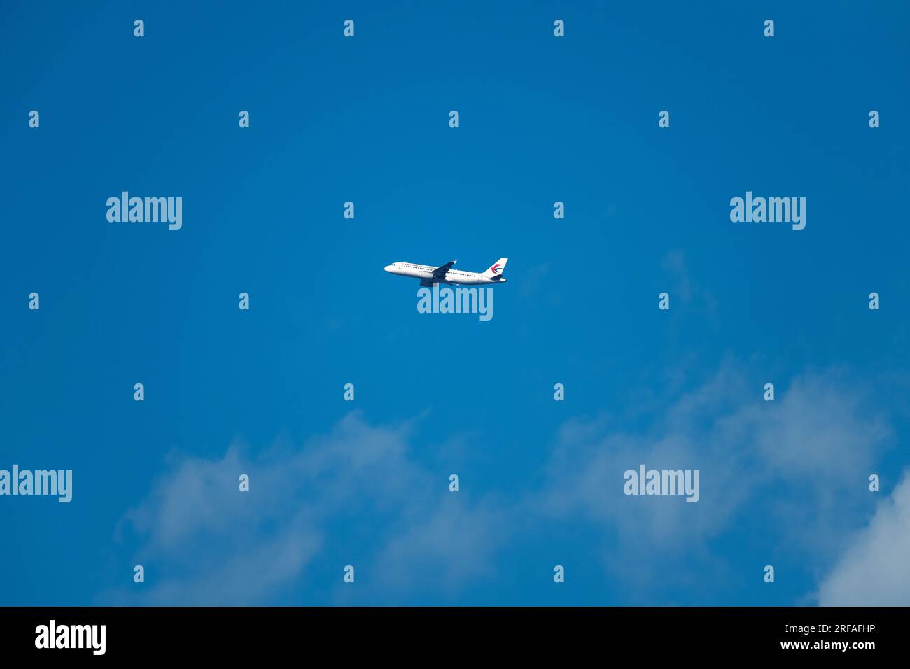Clear sky city airplane Stock Photo - Alamy