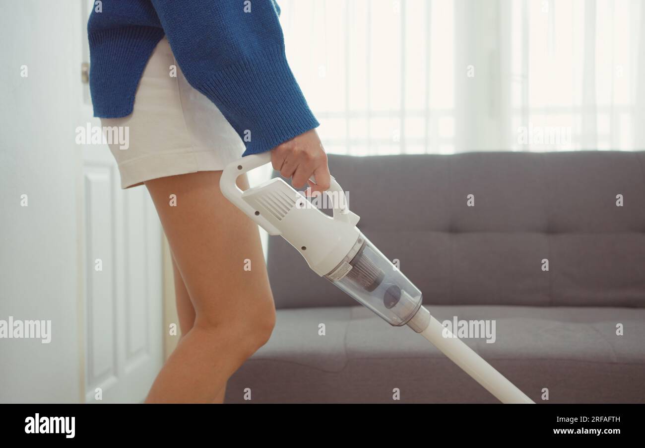 Asian woman vacuuming hi-res stock photography and images - Alamy