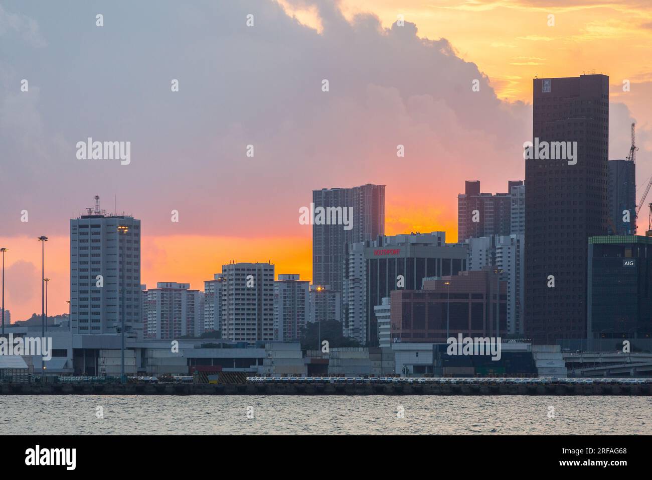 Singapore downtown sunset timing with thick grey cloud on the orange ...