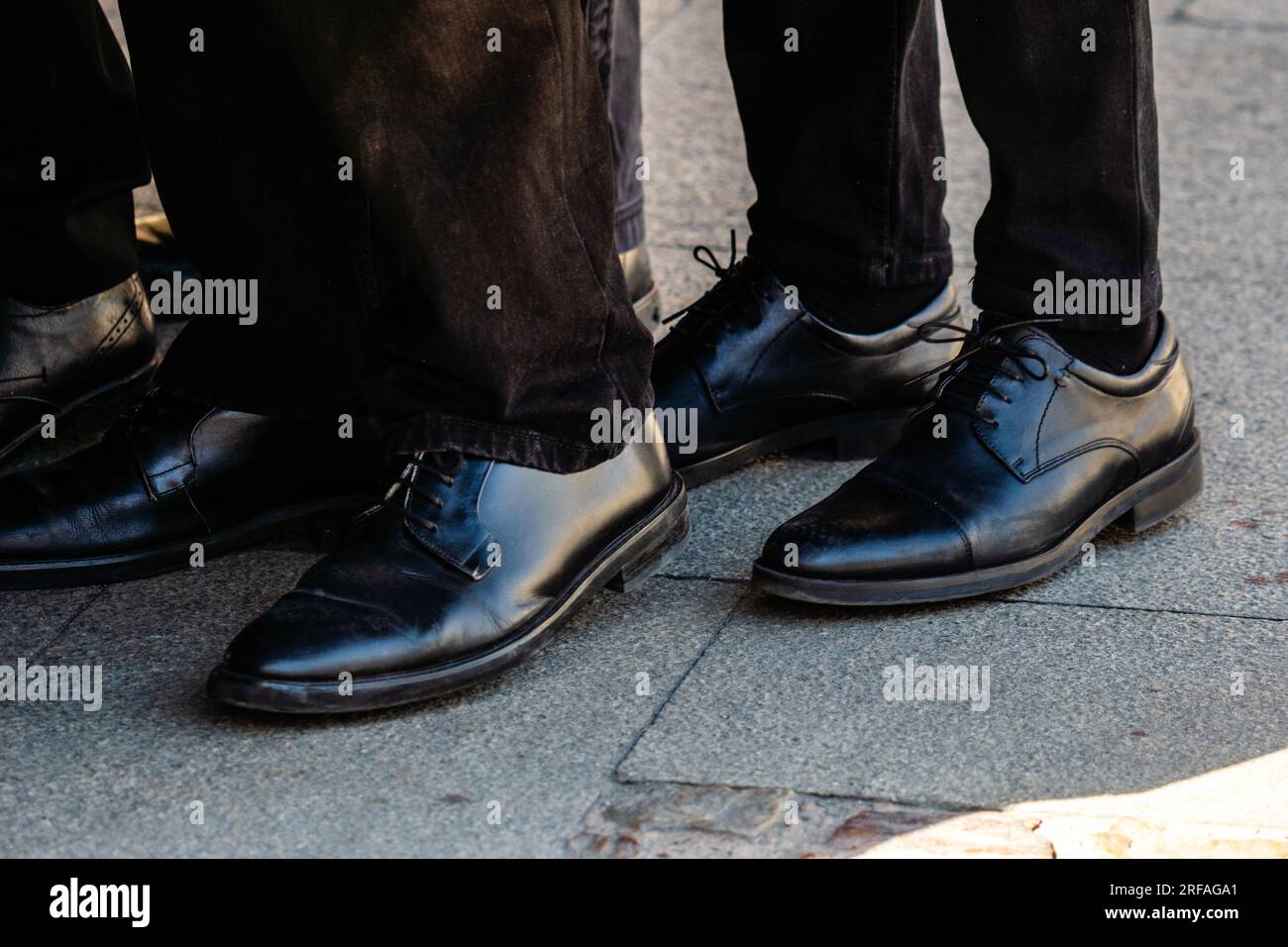 View of the feet of the nazarenes in a religious procession during the ...