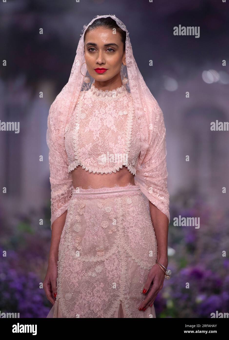 New Delhi, India. 1st Aug, 2023. A model displays a creation by Indian ...