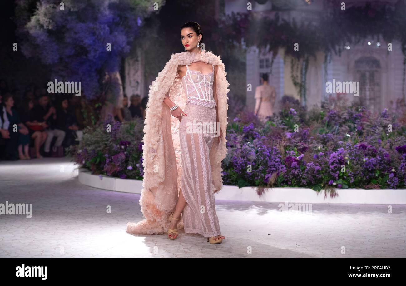 New Delhi, India. 1st Aug, 2023. A model displays a creation by Indian ...