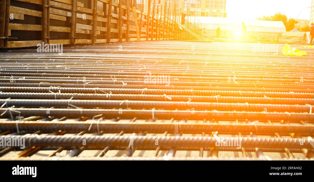worker in the construction site making reinforcement metal framework ...