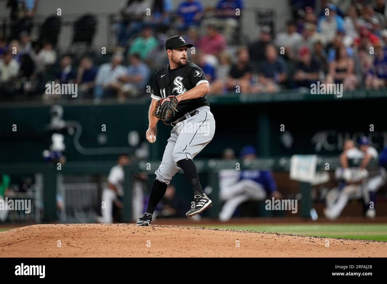 Chicago White Sox relief pitcher Bryan Shaw winds up to deliver to the ...