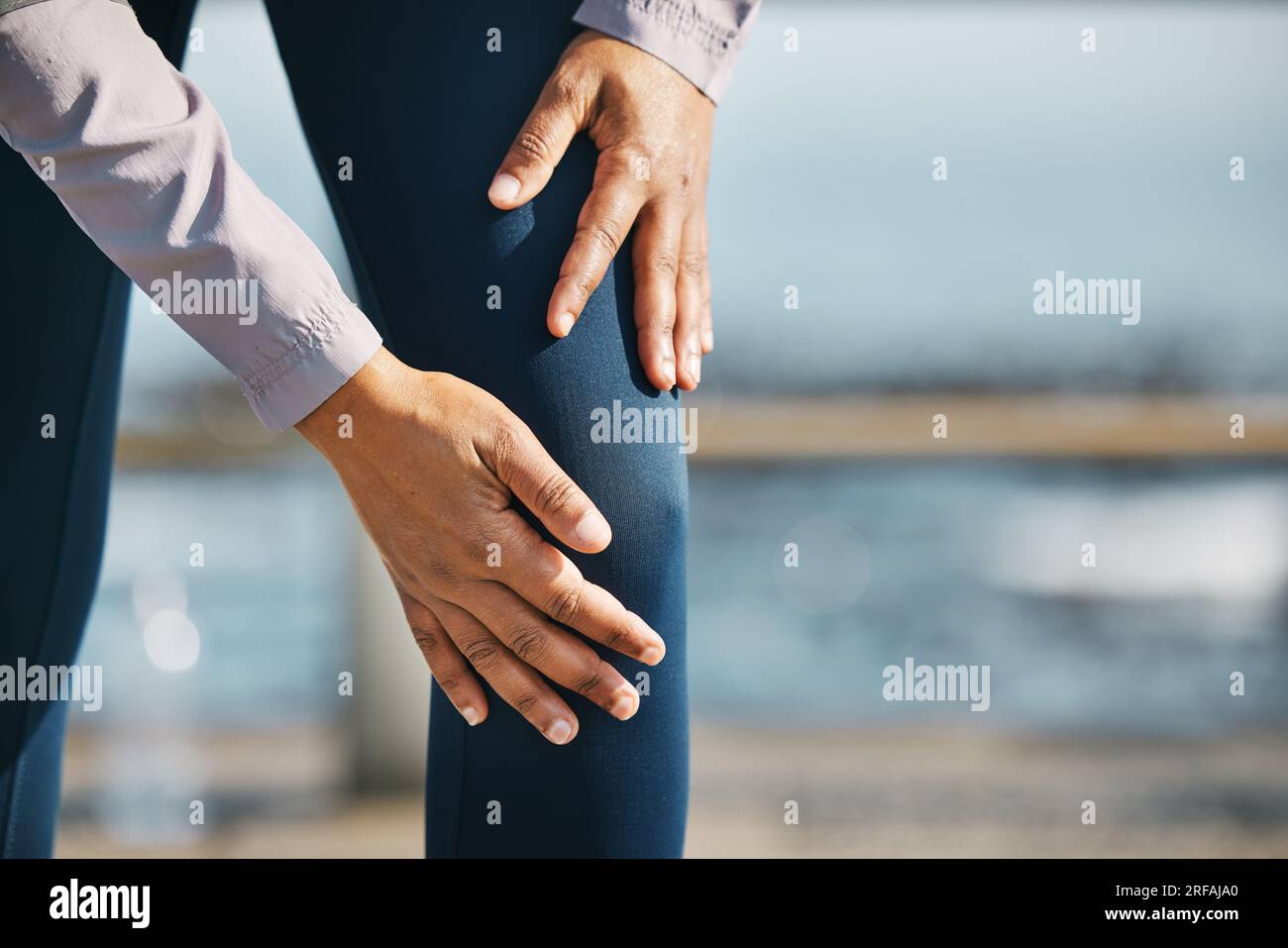 Knee pain, hands and running injury, fitness outdoor and person with ...