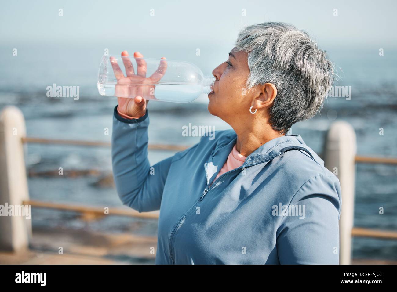 Senior woman drinking water walking hi-res stock photography and images ...