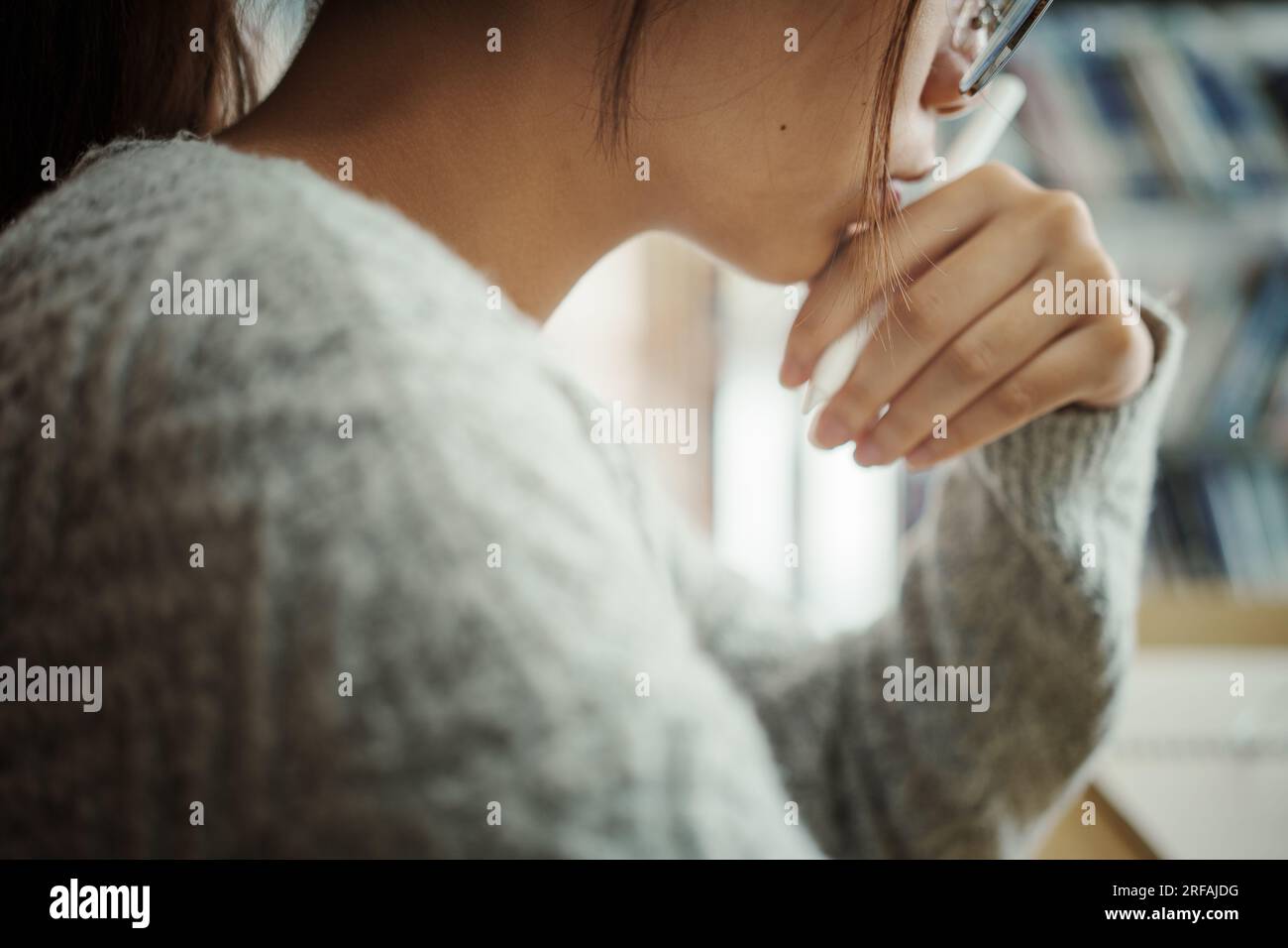 Asian student woman read books in library at university. Young girl ...