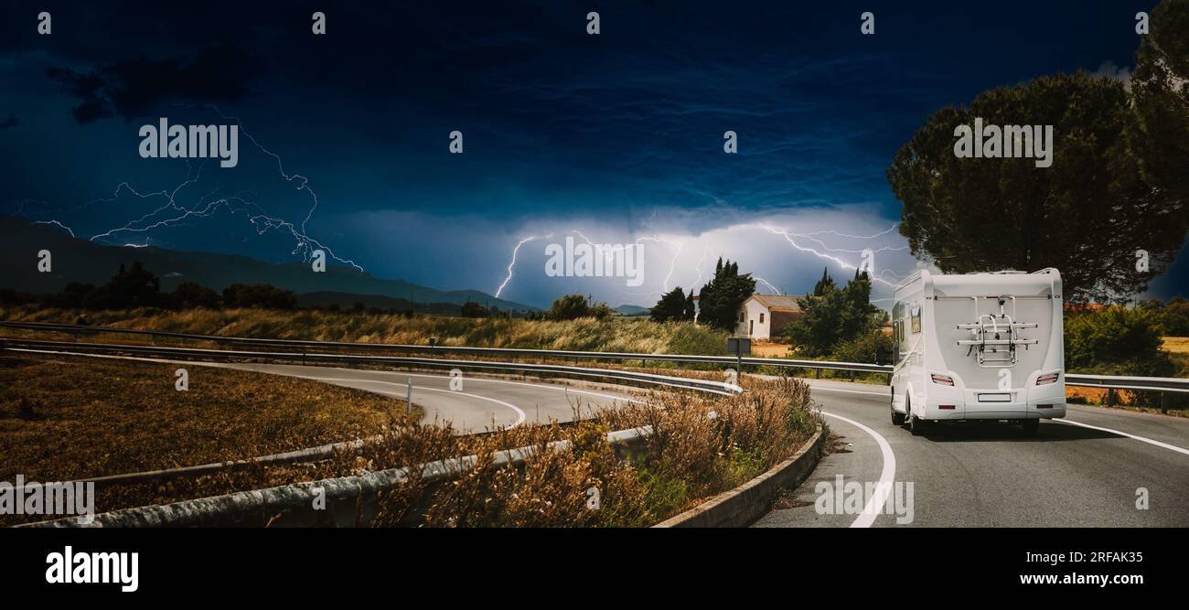 White Caravan Motorhome Car Goes On Highway Road. bad weather ...