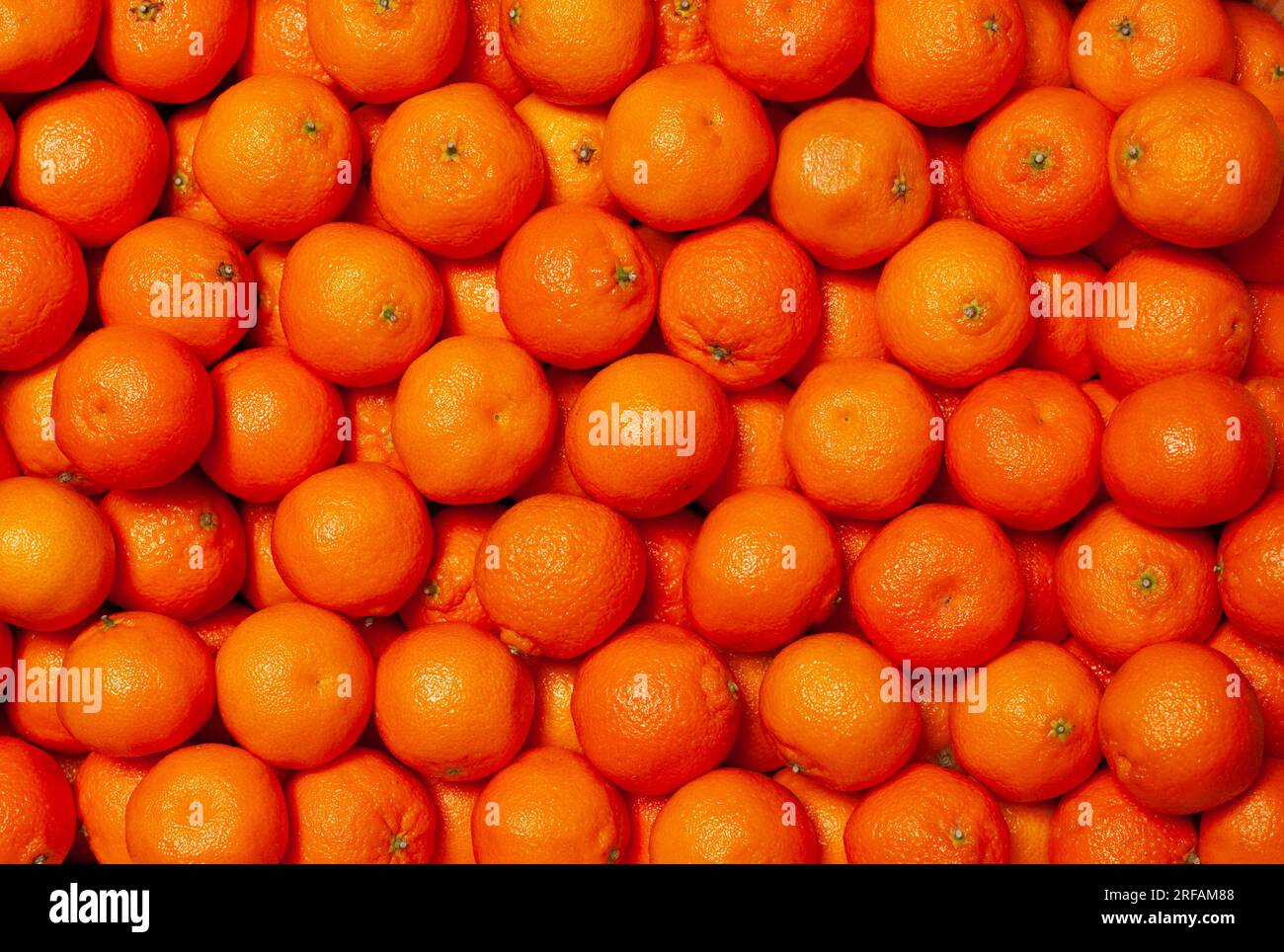 Orange background, food texture. Vivid tangerines Stock Photo - Alamy