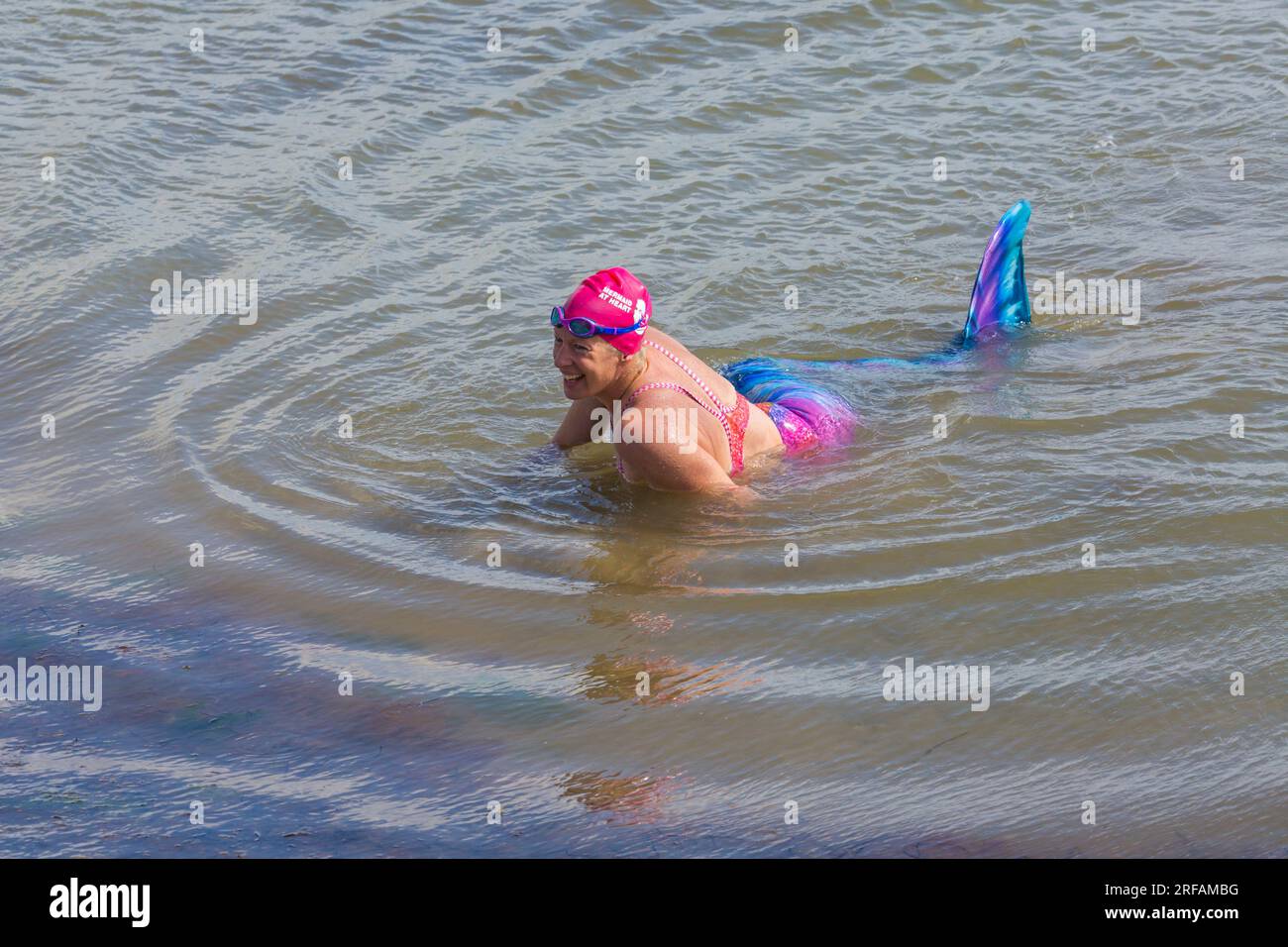 Mermaid in the sea at Swanage, Dorset, UK in July Stock Photo - Alamy