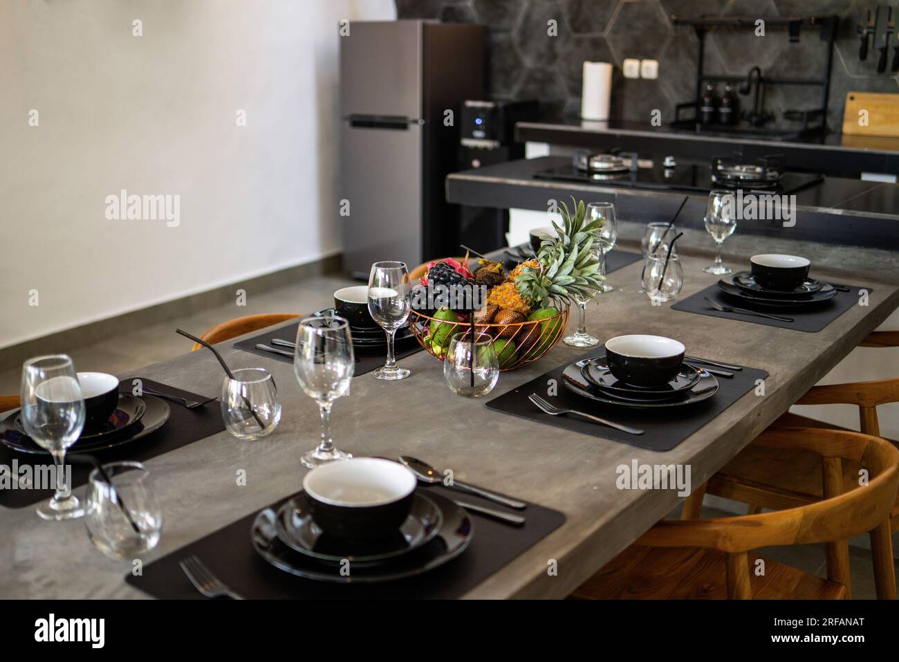kitchen concrete table with gas stove. Dining room with living room ...