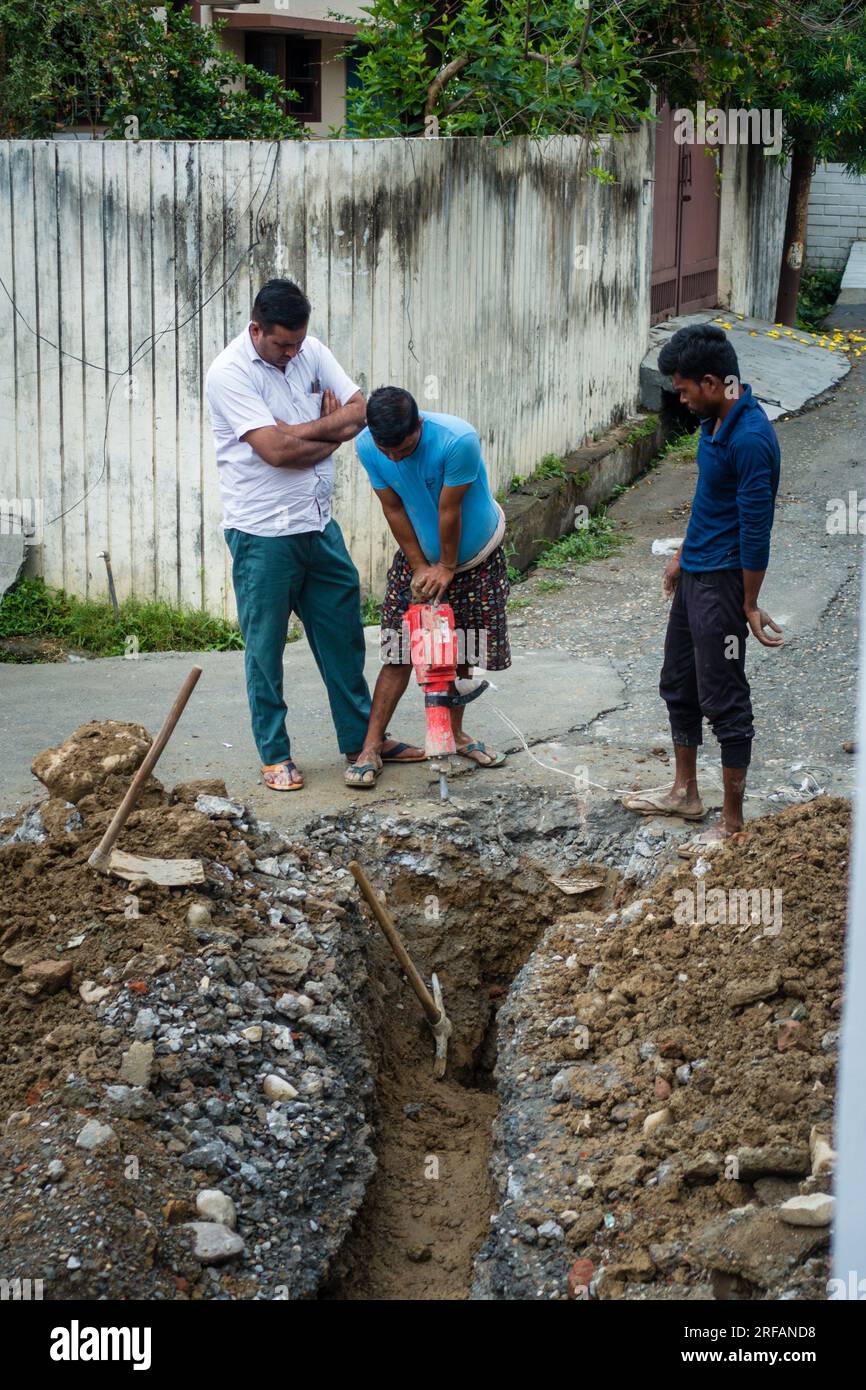Oct.14th 2022 Uttarakhand, India. Worker operating a jackhammer to dig ...