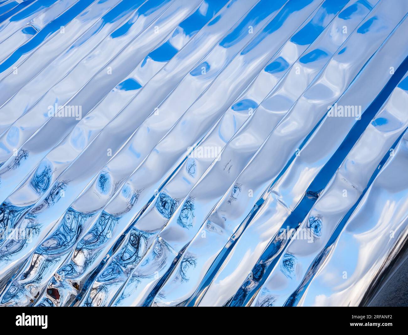 Abstract modern urban metal structure in a row in boomerang curved bent ...