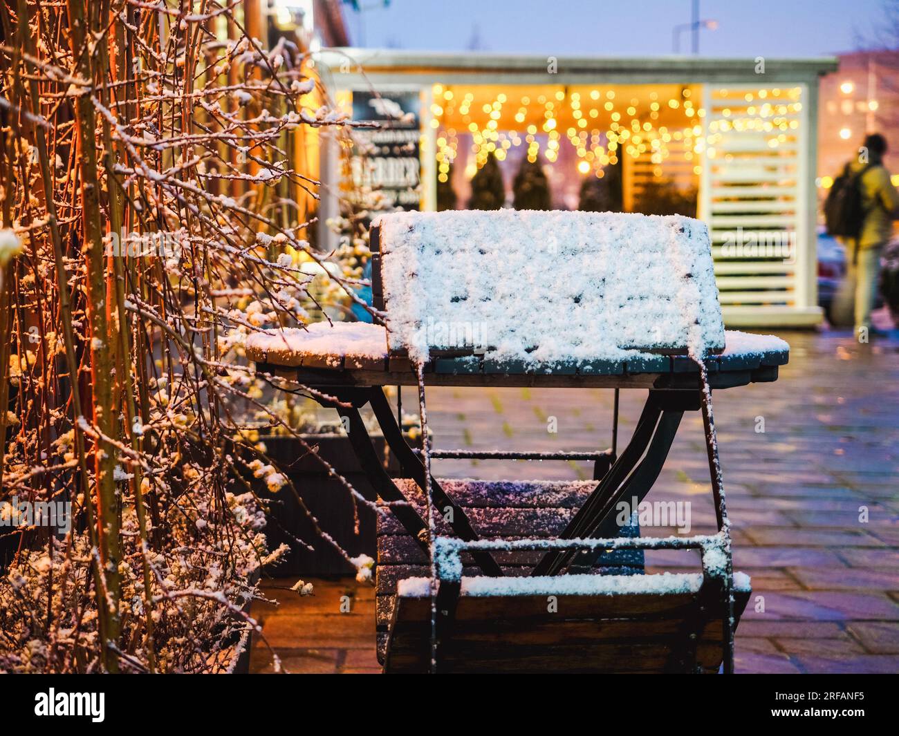 cafe outdoor table and chair covered with snow at winter evening Stock ...