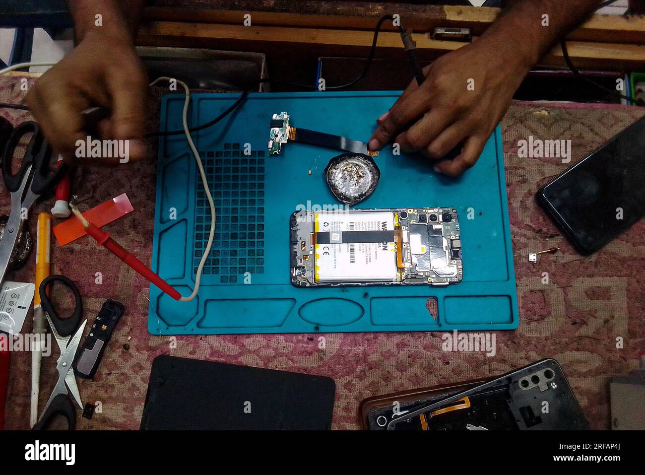 2 October 2023 Dhaka, Bangladesh. Mobile service is being done at the ...