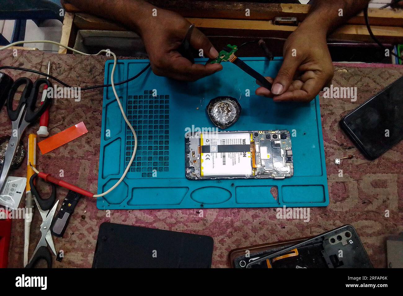 2 October 2023 Dhaka, Bangladesh. Mobile service is being done at the ...