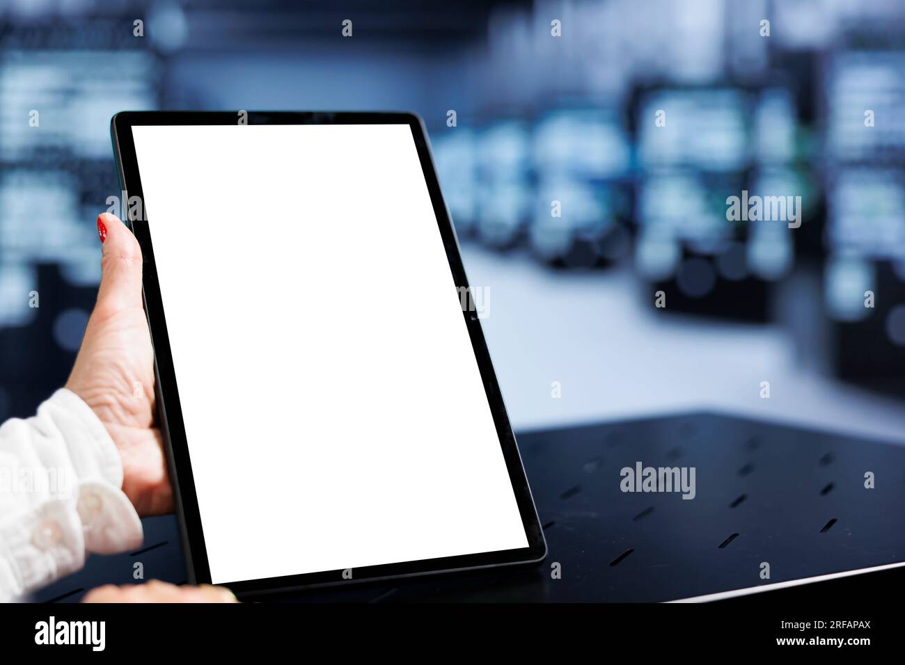 Close up shot of mock up tablet used by engineer in high tech location delivering immense ...