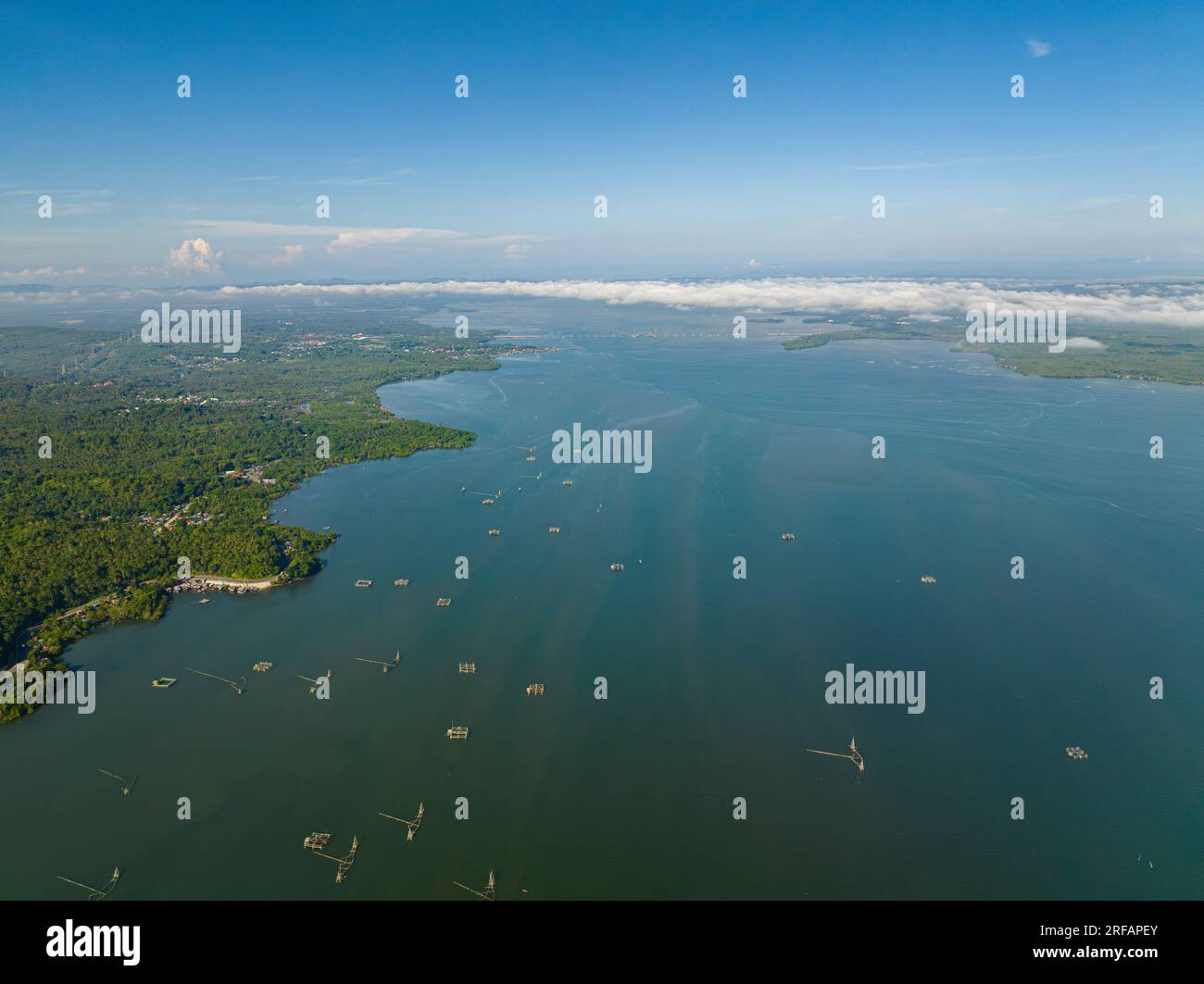 Tropical landscape with mountain with forest and deep blue sea. Lanao ...